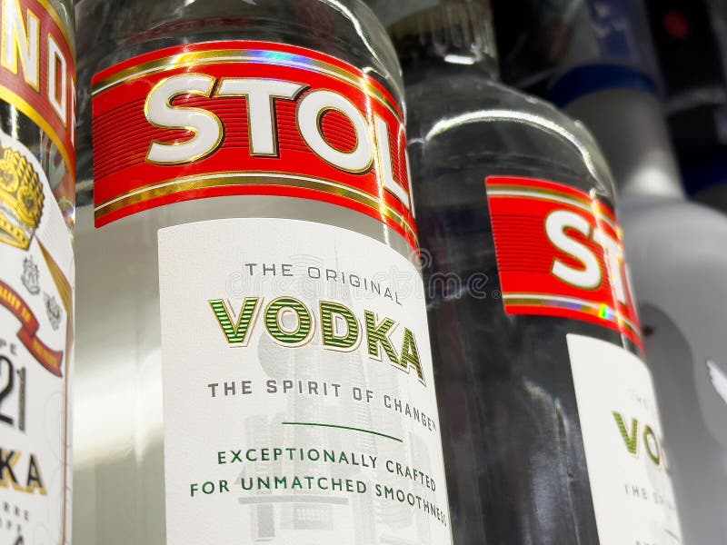 Close-up of Vodka Bottles with Bold Red Labels on Display Shelf ...