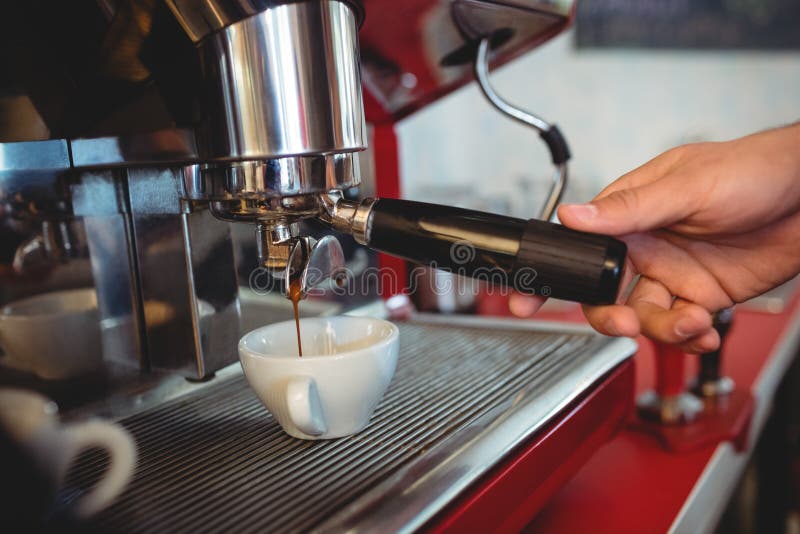 Close-up of Waiter Holding Coffee Maker Handle at Cafe Stock Photo ...