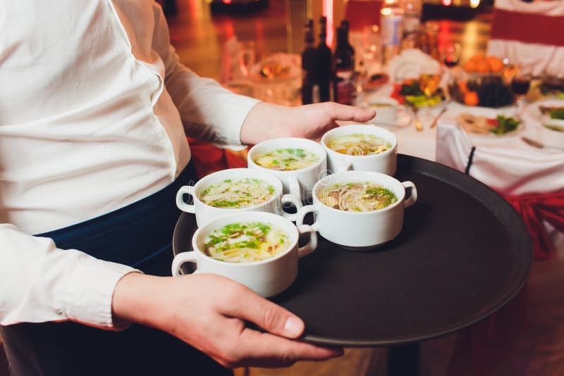 Close Up of Waiter Serving Food in a Restaurant. Soft Focus. Stock ...