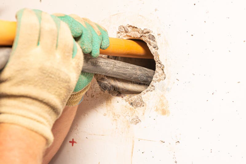 Wall Breakthrough through a Core Hole by Professionals for the ...