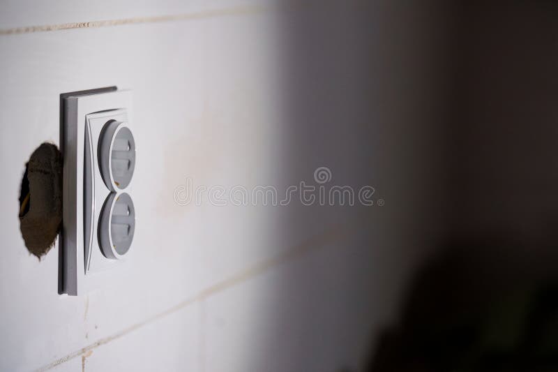 Close-up of a Wall Electrical Outlet with Surrounding Texture and ...