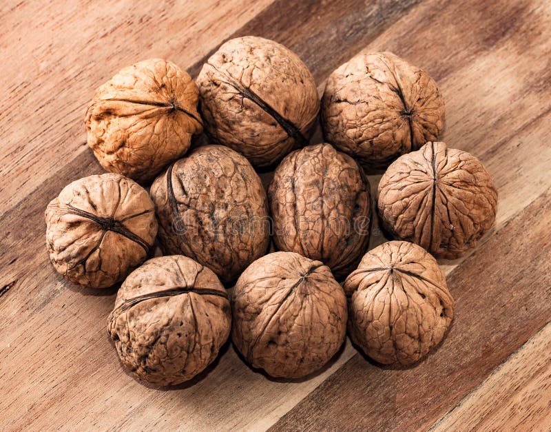 Close Up of Wall Nuts on a Wooden Table Stock Photo - Image of seed ...