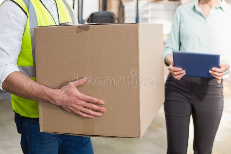 Close Up of a Warehouse Worker Carrying Box Stock Photo - Image of ...