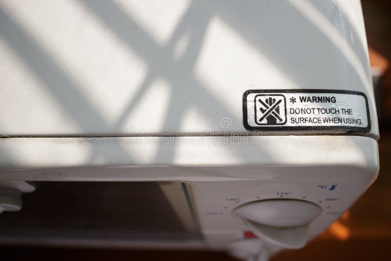 Close-Up of Warning Label on Kitchen Appliance Stock Image - Image of ...