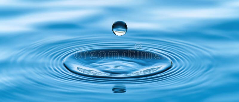 A Close-up of a Water Drop Creating Ripples upon Impact with a Surface ...