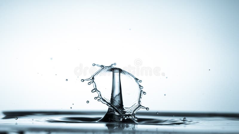 Close-up of a Water Drop Falling on Water Surface Stock Image - Image ...