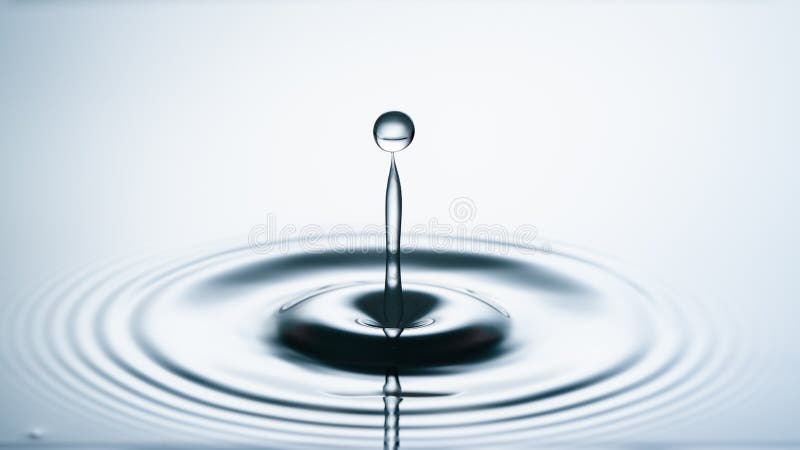 Close-up of a Water Drop Falling on Water Surface Stock Image - Image ...