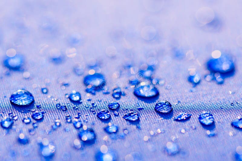 Close Up Water Drops Pattern Over a Blue Waterproof Cloth Stock Photo ...