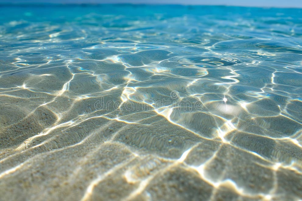A Close Up of the Water Ripples on the Sand of a Beach Stock Image ...