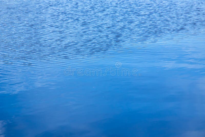 Close Up of Water Surface Reflecting Blue Sky and Clouds Stock Photo ...