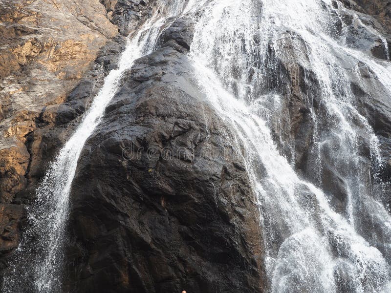 The Waterfall Movement in the Park. the Stream of Water Flows Around ...