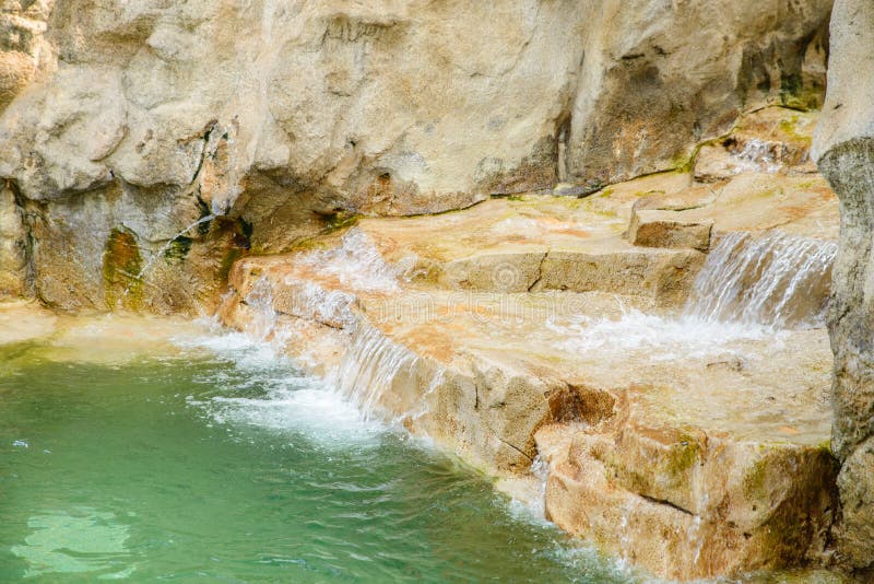 Close Up of Waterfall in Outdoor Pool at Resort. Stock Photo - Image of ...