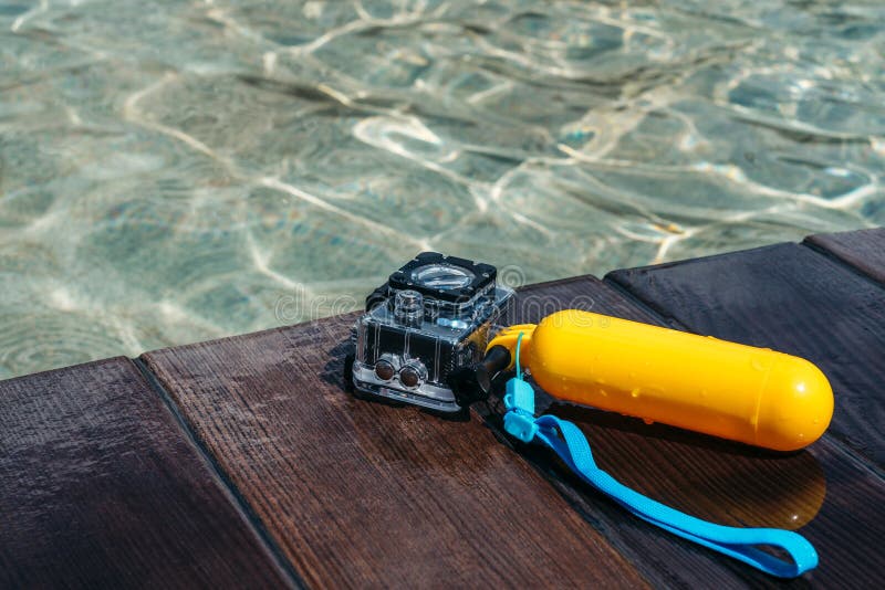 Waterproof Action Camera with a Yellow Float in a Man`s Hand ...