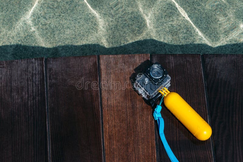 Waterproof Action Camera with a Yellow Float in a Man`s Hand ...