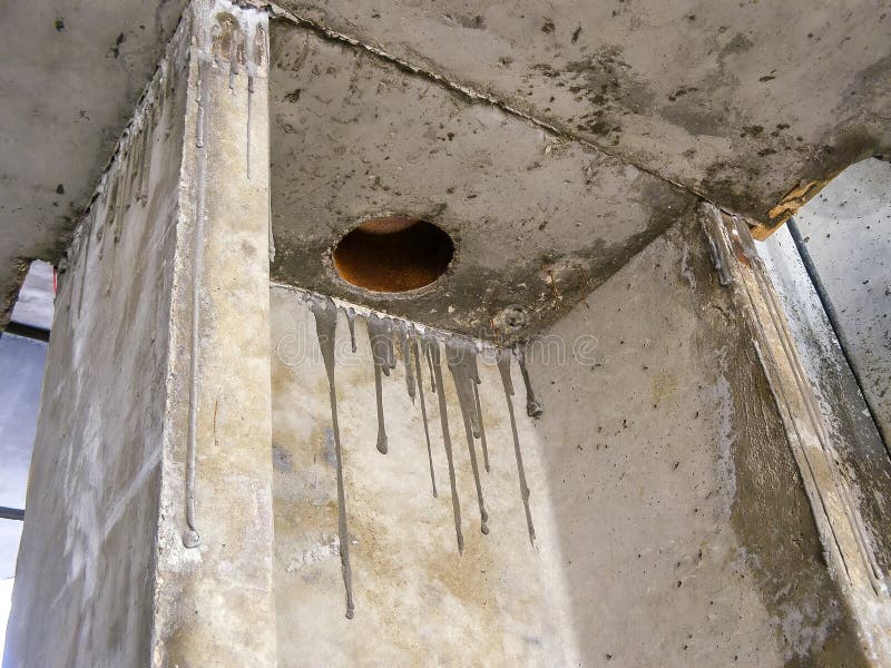 Close-up of Weathered Concrete Structures with Dark Drips and a Round ...