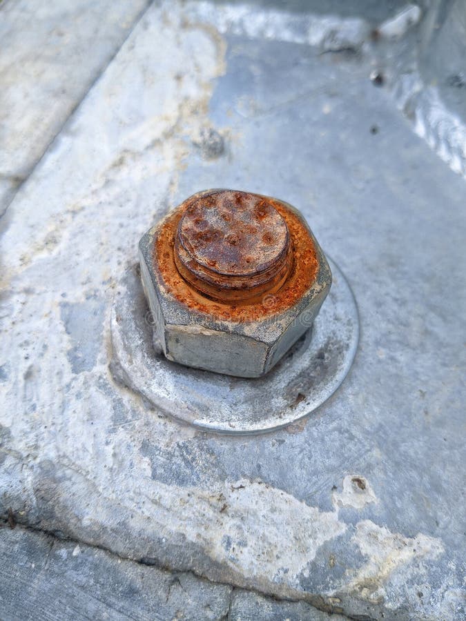 Rusty Bolt Head Protruding from a Concrete Surface. Stock Image - Image of colored, metal: 352389287
