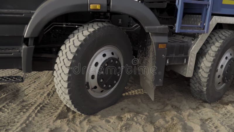 Close Up of Wheels of a Slowly Moving Truck on Sandy Surface. Scene ...
