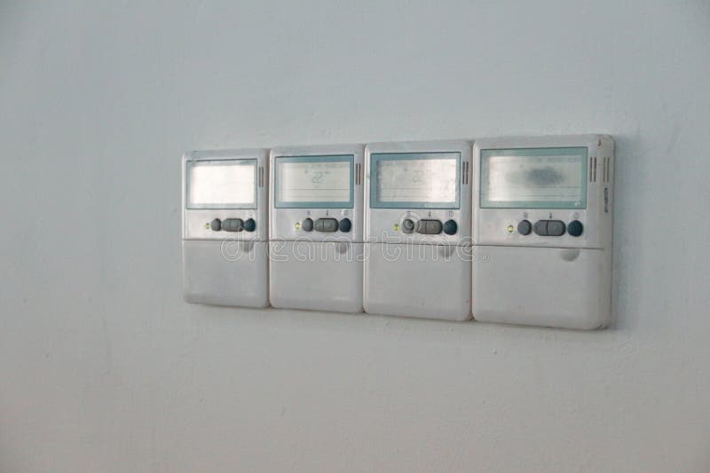 Close-up of a White AC Control Unit with a Green Backlit Display ...