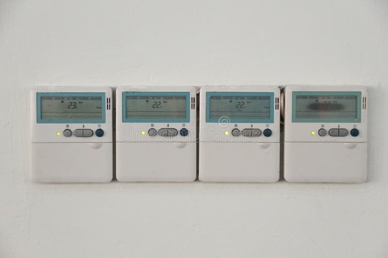 Close-up of a White AC Control Unit with a Green Backlit Display ...