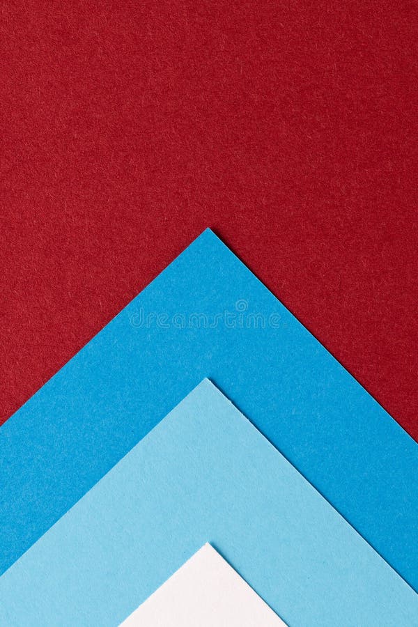 Close Up of White and Blue Paper on Red Background with Copy Space ...