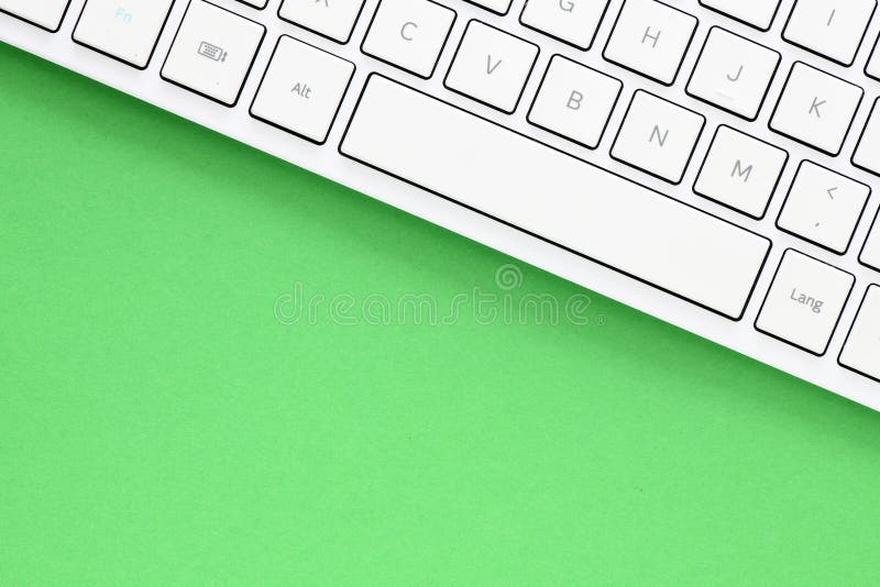 Close Up White Computer Keyboard on Green Background. View from Above ...