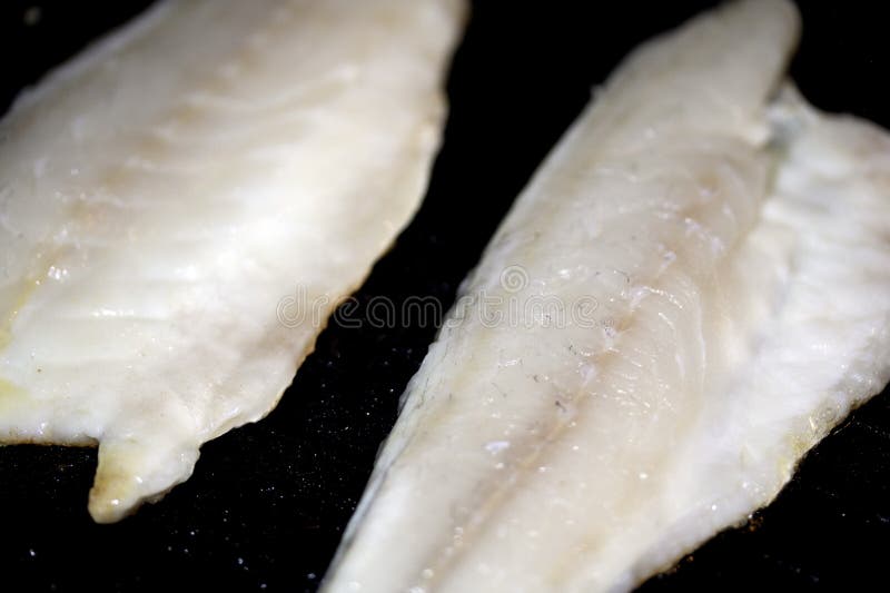 Close Up of White Fish Steak Cooking in the Frying Pan for Dinner Stock ...