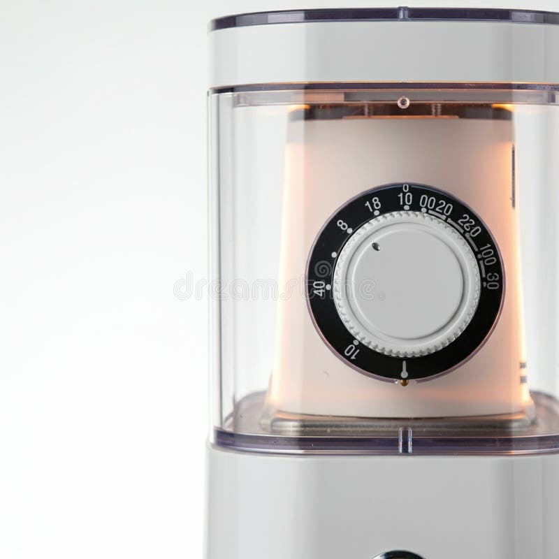 A Close-up of a White Kitchen Timer Set within a Transparent ...