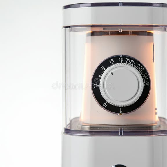 A Close-up of a White Kitchen Timer Set within a Transparent ...
