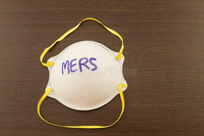 Close Up of White Mask Stack and Word MERS in Mask on Black Wooden ...
