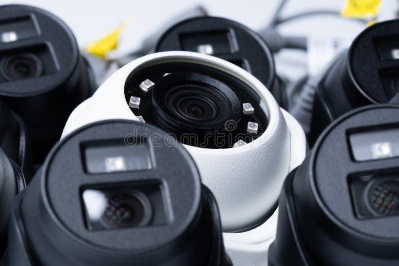 Close-up of a White Security Camera Surrounded by Black Cameras Stock ...