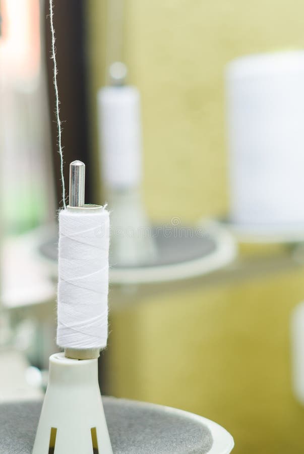 A Spool of Thread and a Needle with a Thread Stock Photo - Image of ...
