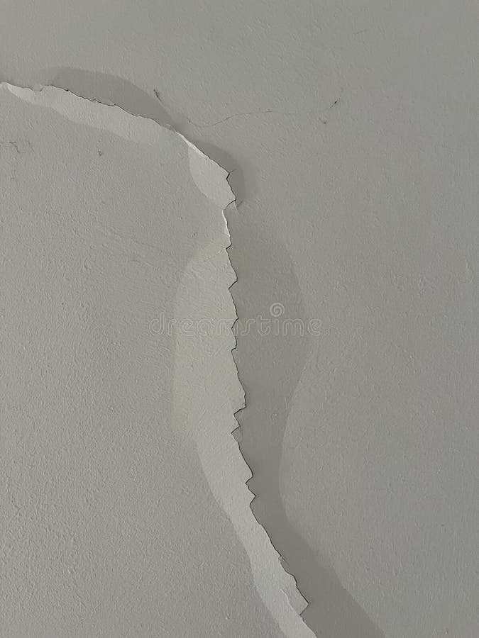 Closeup of White Wall Cracked from Top To Bottom by the Earthquake ...