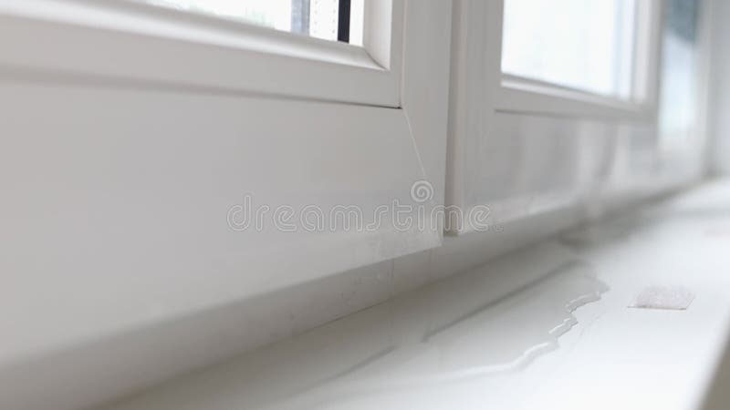 Close-up of Window Frame with Leaking Water, a Puddle on the Windowsill ...