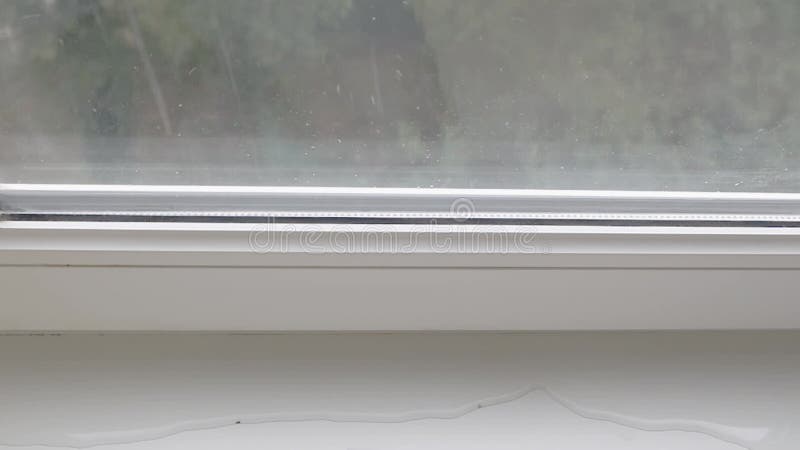 Close-up of Window Frame with Leaking Water, a Puddle on the Windowsill ...