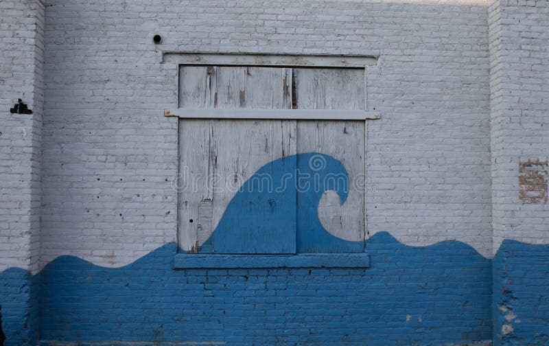 Close-up of a Window with Its Shutter with a Blue Ocean Wave Painting ...