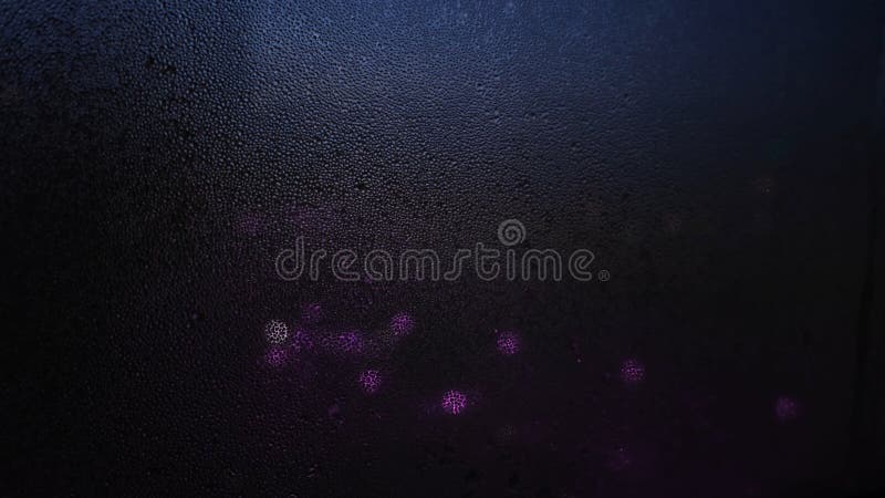 Close-up of Window with Raindrops on Blurred Background of Lights ...