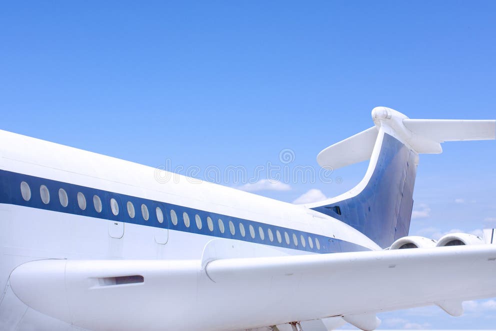 Close Up of Windows and Tail Fin Plane Stock Image - Image of blue ...