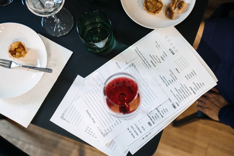 Close-up of Wine Tasting Session with Red Wine Glass, Printed Tasting ...