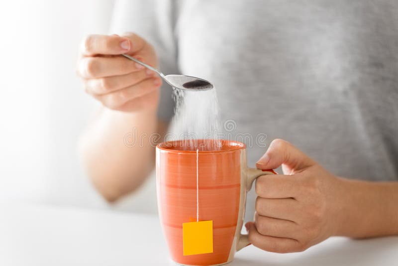Close Up of Woman Adding Sugar To Cup of Tea Stock Photo - Image of ...