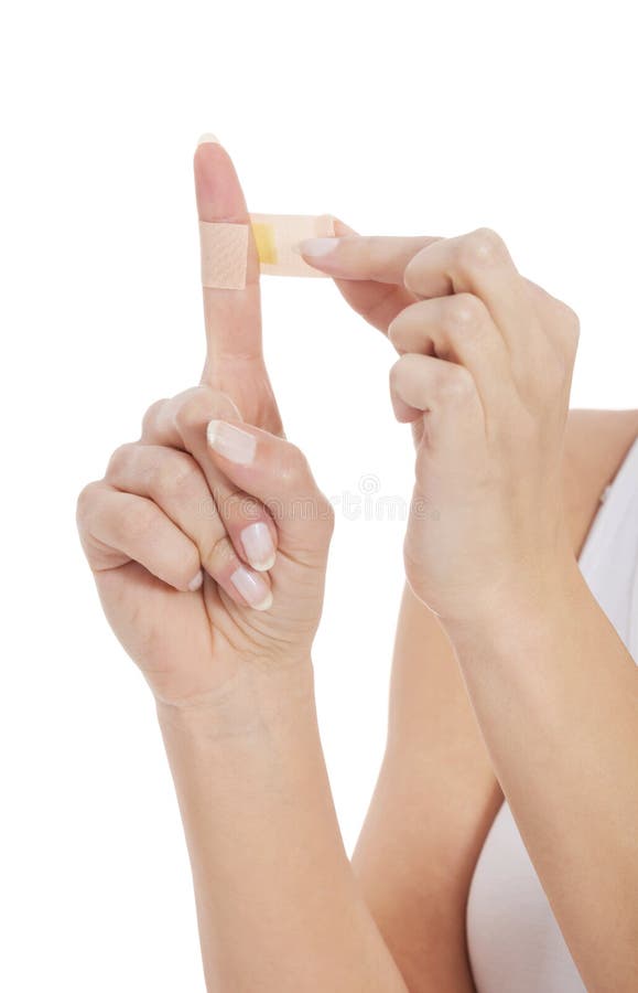 Close Up of Woman Applying Plaster on Finger Stock Image - Image of ...