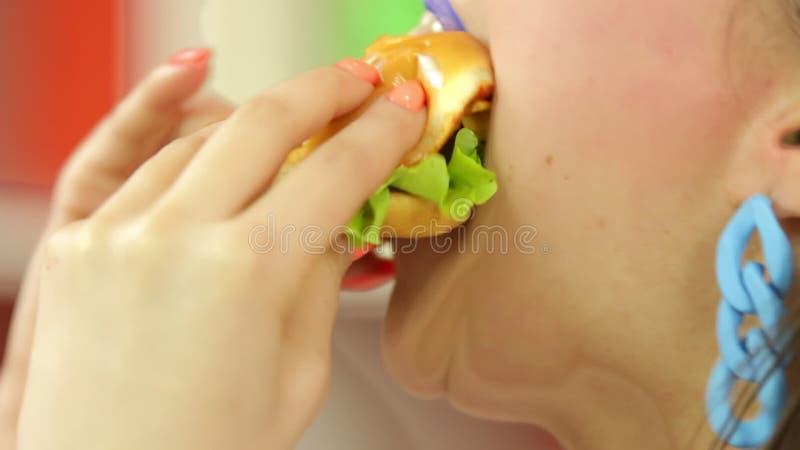 Close-up of a Woman Biting a Burger Stock Video - Video of food ...