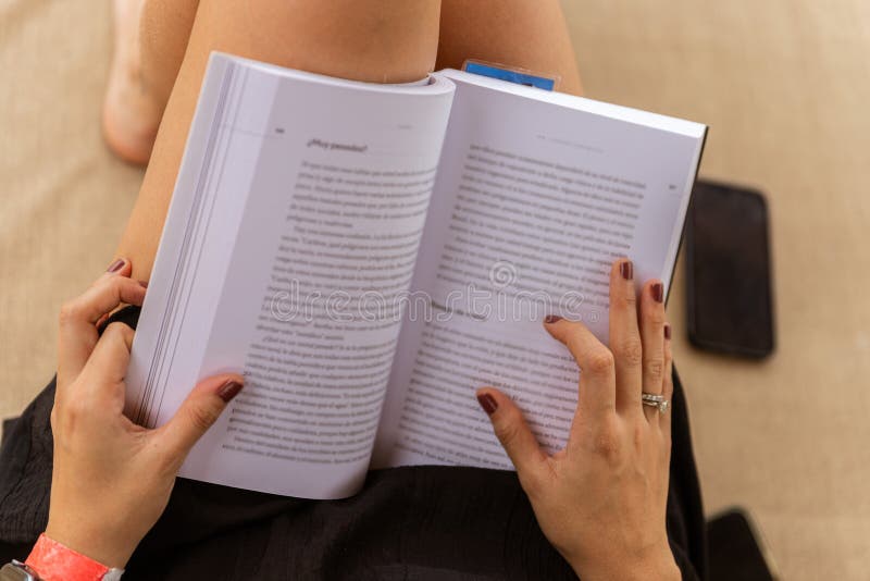 Close Up of a Woman with a Book in Her Hands in a Beach Bed Stock Photo ...