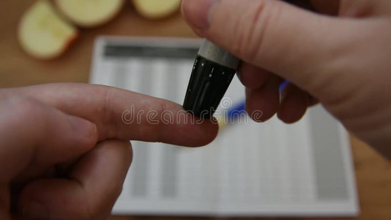 Close-up Woman Checking Blood Sugar with Diabetes To Test Blood Glucose ... Close-up Woman Checking Blood Sugar with Diabetes To Test Blood Glucose ...
