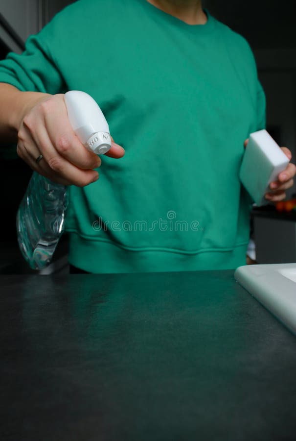 Close Up of Woman Cleaning with Spray and Sponge the Bar Surface in the ...