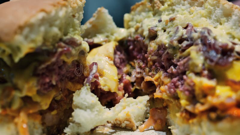Close Up of a Woman Cutting a Burger on a Plate at Stock Video - Video ...