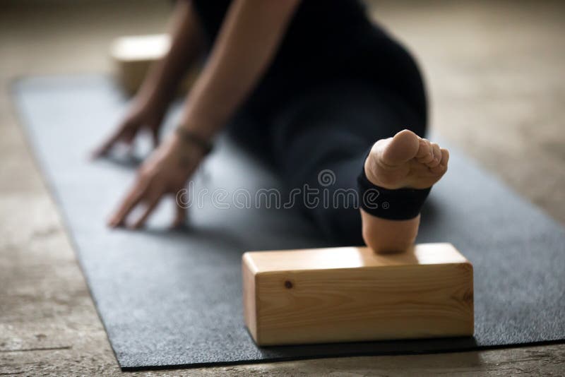 Close Up of Woman Doing Splits with Block for Deep Stretch Stock Photo ...