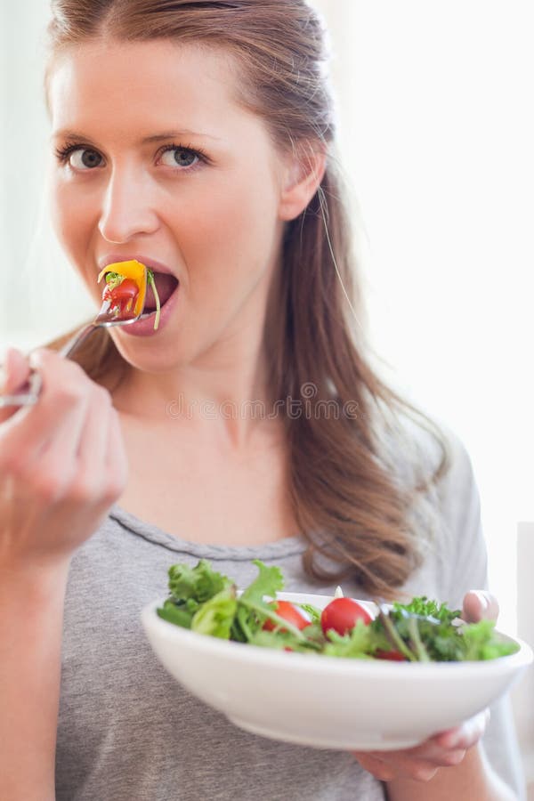 Close Up of Woman Eating Salad Stock Photo - Image of dinner, eating ...