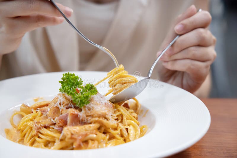 Close-up on Woman Eating Spaghetti with a Fork Stock Photo - Image of ...