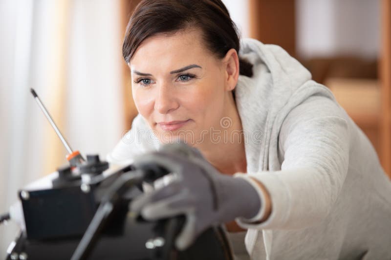 Close Up Woman Fixing Machine Stock Photo - Image of drill, industry ...