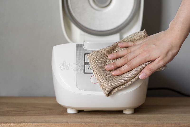 Close Up Woman Hand Cleaning Rice Cooker with Cloth. Stock Image ... Close Up Woman Hand Cleaning Rice Cooker with Cloth. Stock Image ...